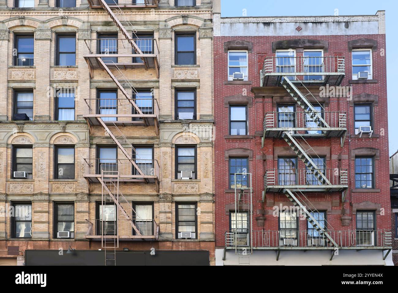 New York City, old apartment building with external fire ladder and ...