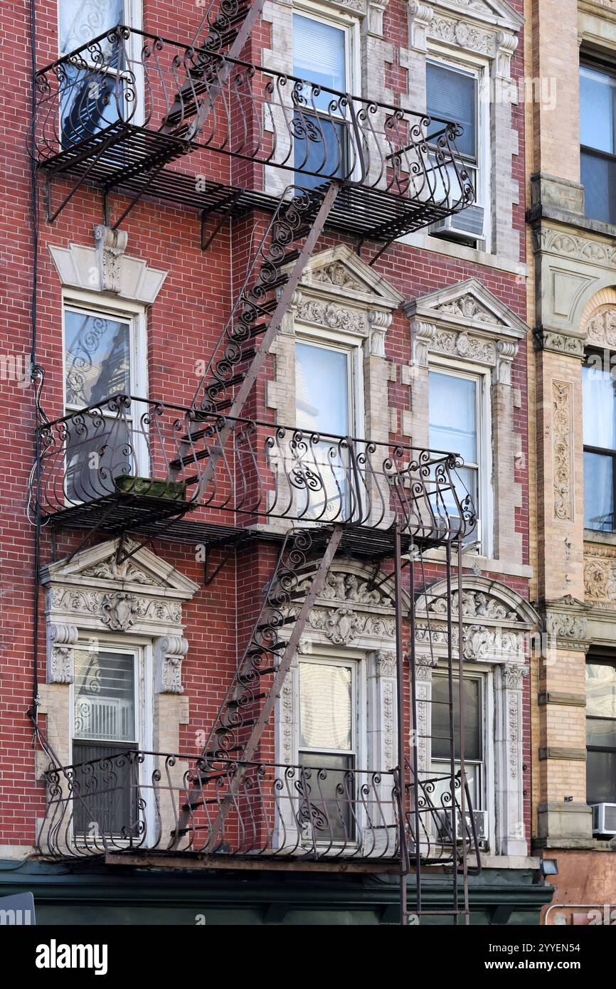 New York City, old apartment building with external fire ladder and ...