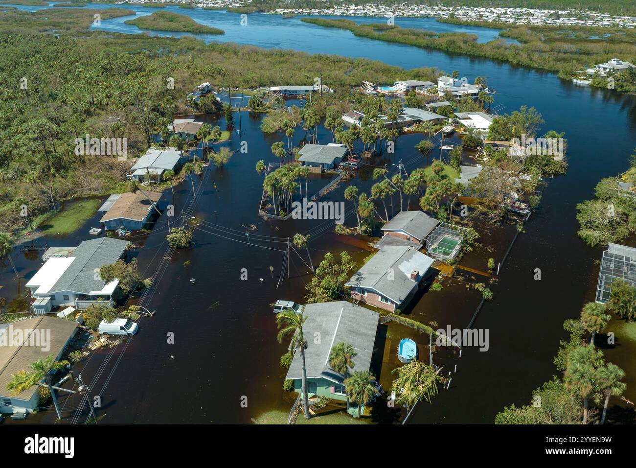 Aftermath of natural disaster. Flooded houses by hurricane Ian rainfall ...