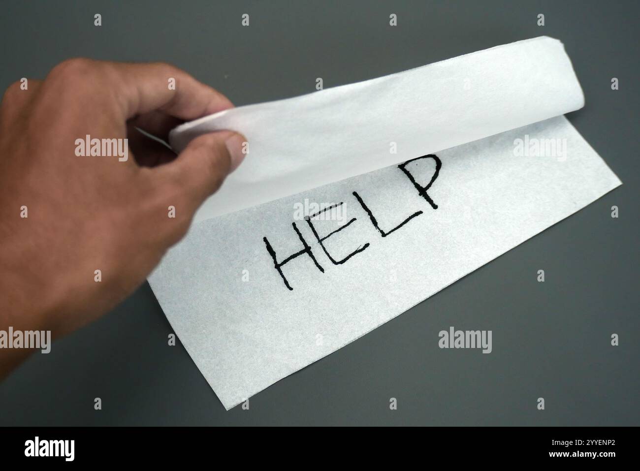 Hand opens a tissue cupboard with the words help, concept of assistance ...