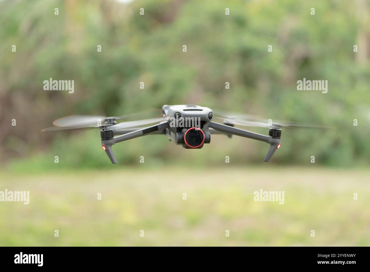 Drone quadcopter with digital camera and fast rotating propellers ...