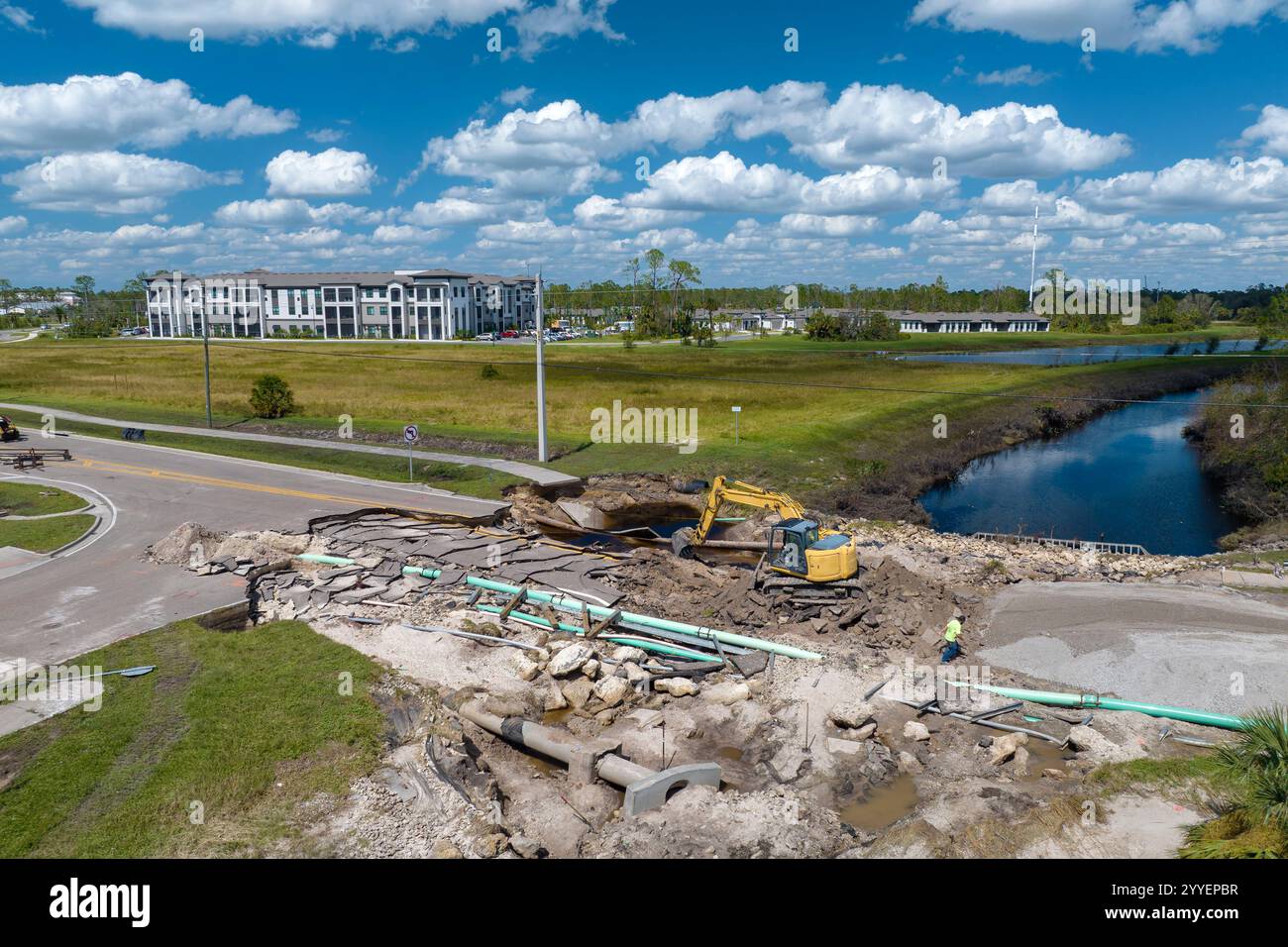 Reconstruction of damaged road bridge destroyed by river after flood ...