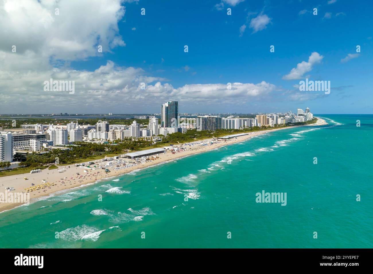 South Beach sandy surface with tourists relaxing on hot Florida sun ...
