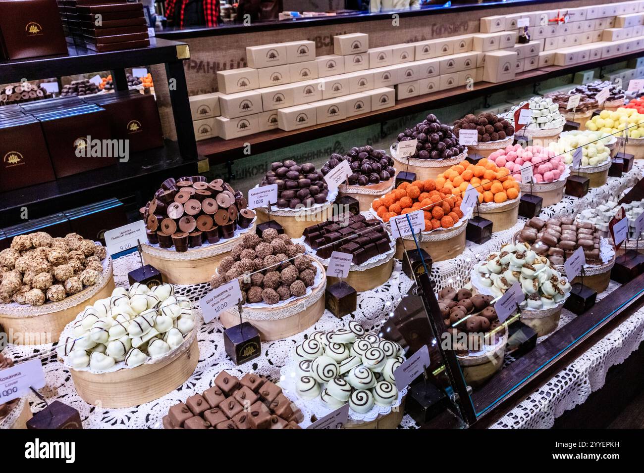 A display of assorted chocolates and candies. The display is organized ...
