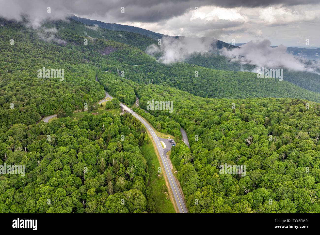 Winding mountain road in summer woods. Beacon Heights parking lot ...