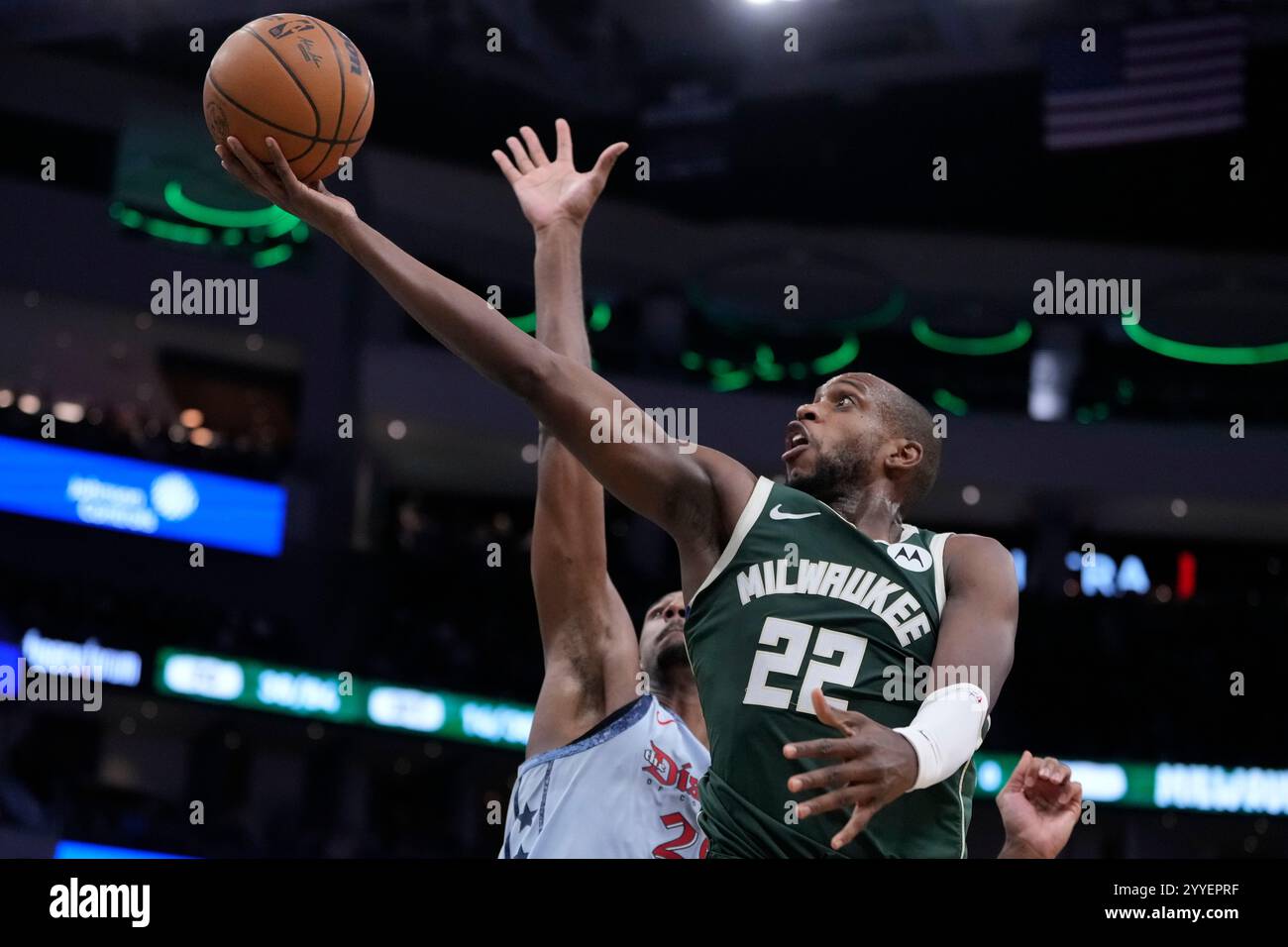 Milwaukee Bucks' Khris Middleton shoots past Washington Wizards' Corey ...