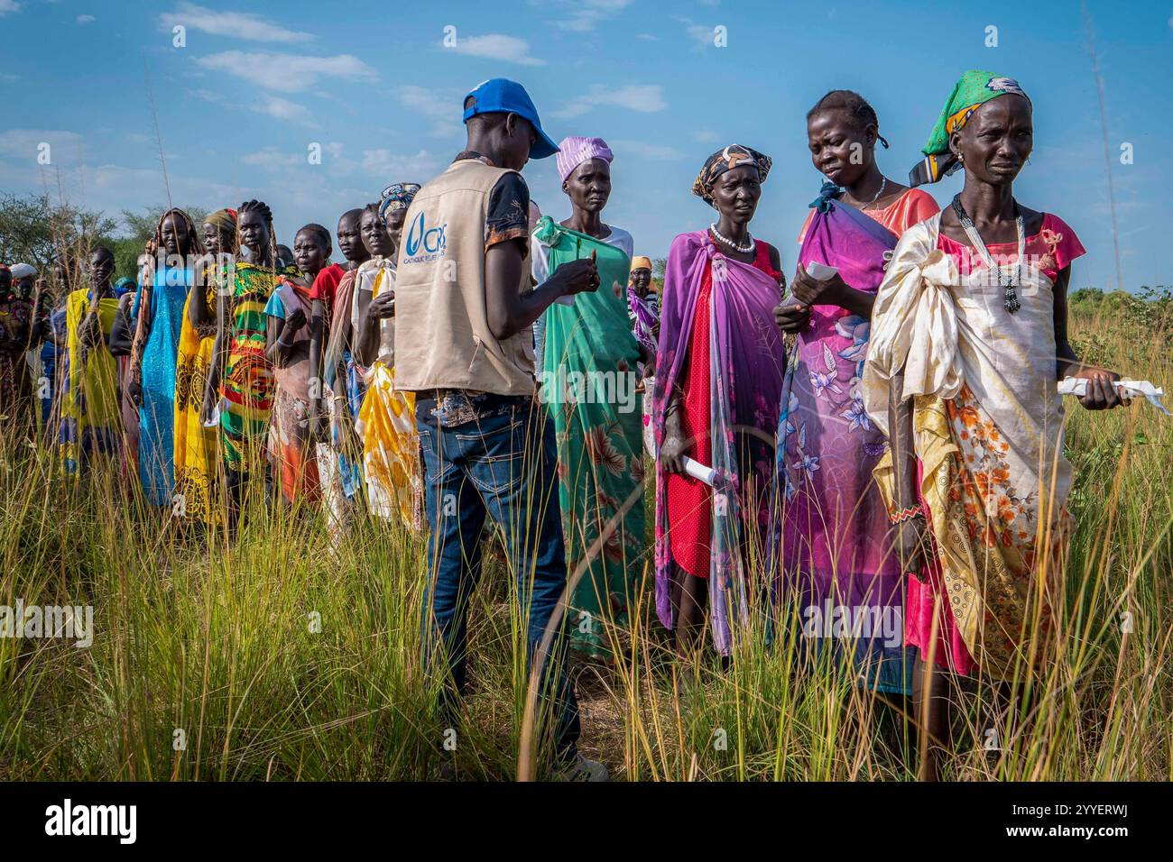 South Sudanese women line up for food rations at a World Food Programme ...