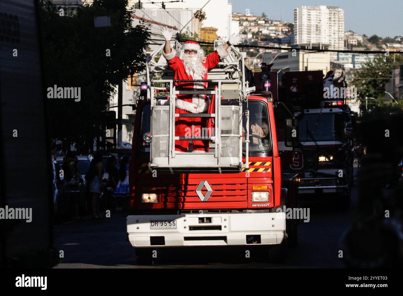 Valparaiso, Chile. 21st Dec, 2024. A firefighter is carried on a truck ...