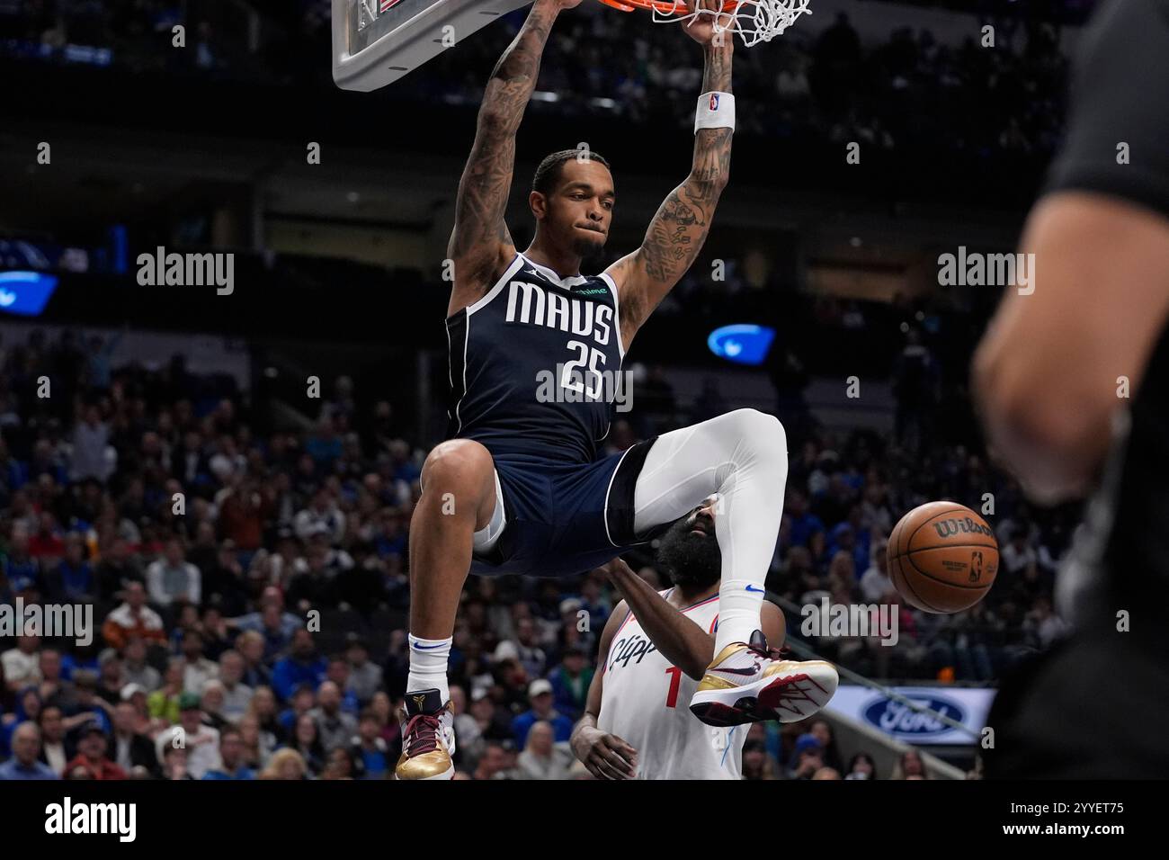 Dallas Mavericks forward P.J. Washington (25) slam dunks during the second half of an NBA ...