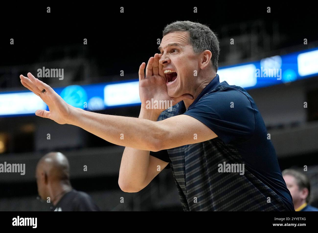California head coach Mark Madsen yells toward players during the first ...