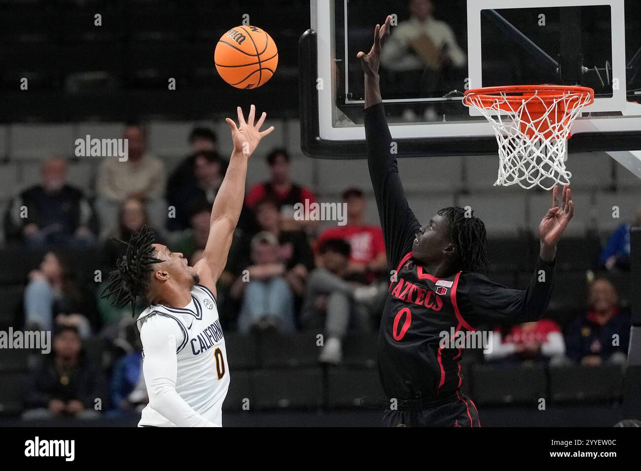 San Diego State forward Magoon Gwath, right, jumps to block a shot ...