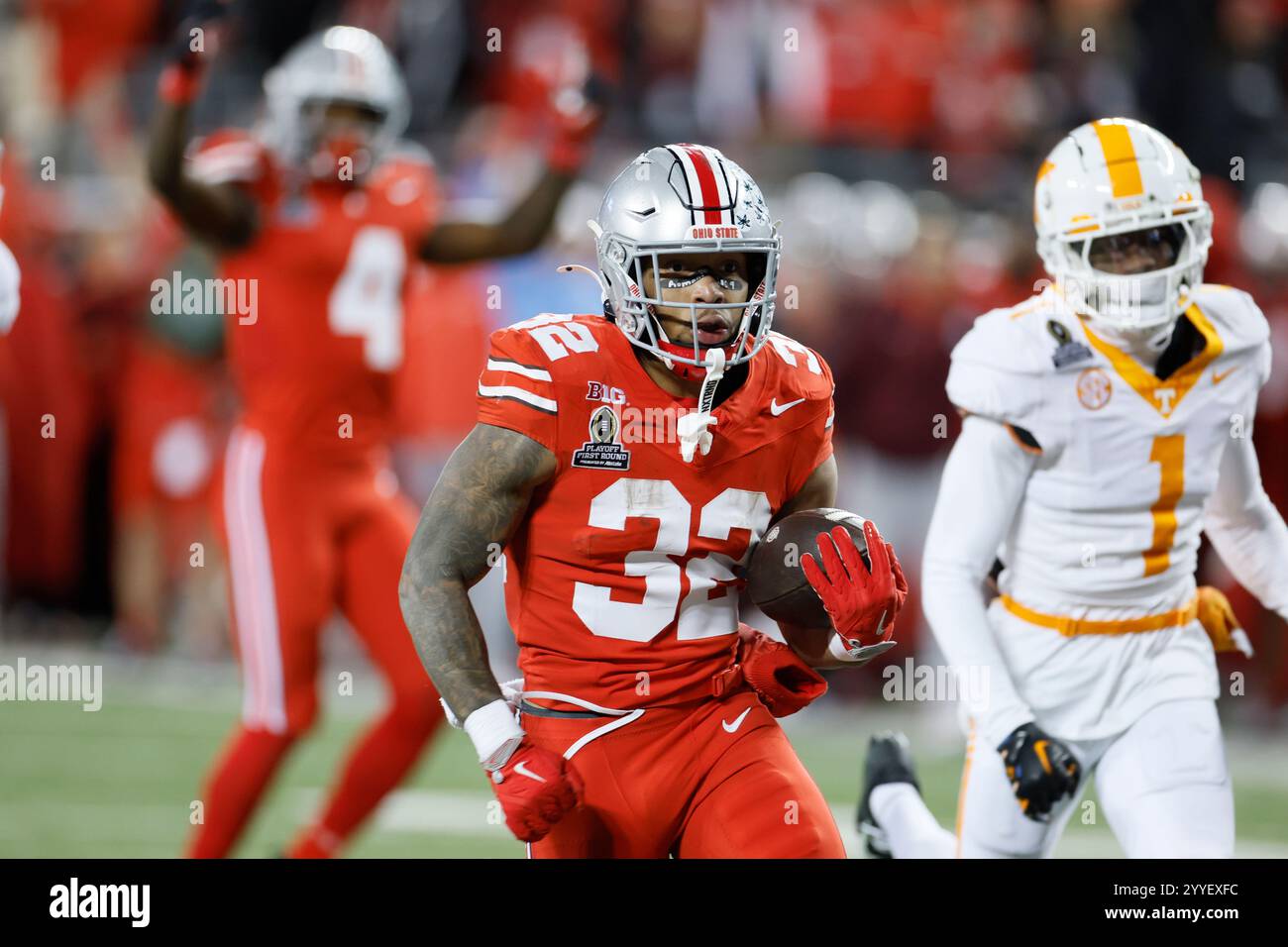 Ohio State running back TreVeyon Henderson, front, scores a touchdown ...