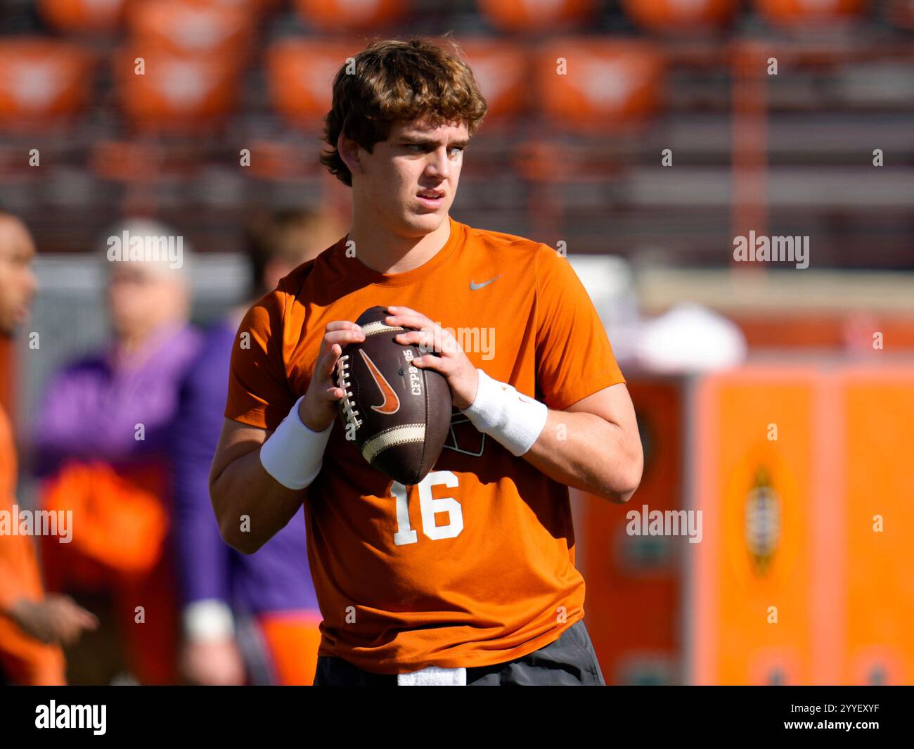 Austin, Texas. 21st Dec, 2024. Texas quarterback Arch Manning (16) warms up on the field before ...