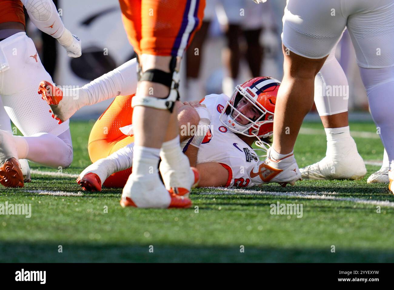 Austin, Texas. 21st Dec, 2024. Clemson quarterback Cade Klubnik (2) is sacked during the first ...