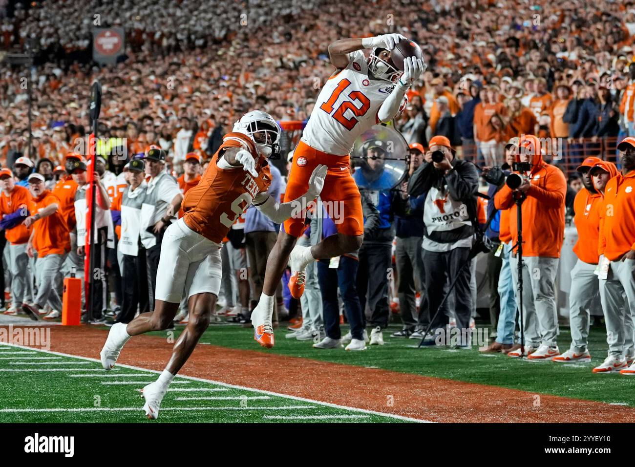 Austin, Texas. 21st Dec, 2024. Clemson wide receiver Bryant Wesco Jr. (12) goes up to bring in a ...
