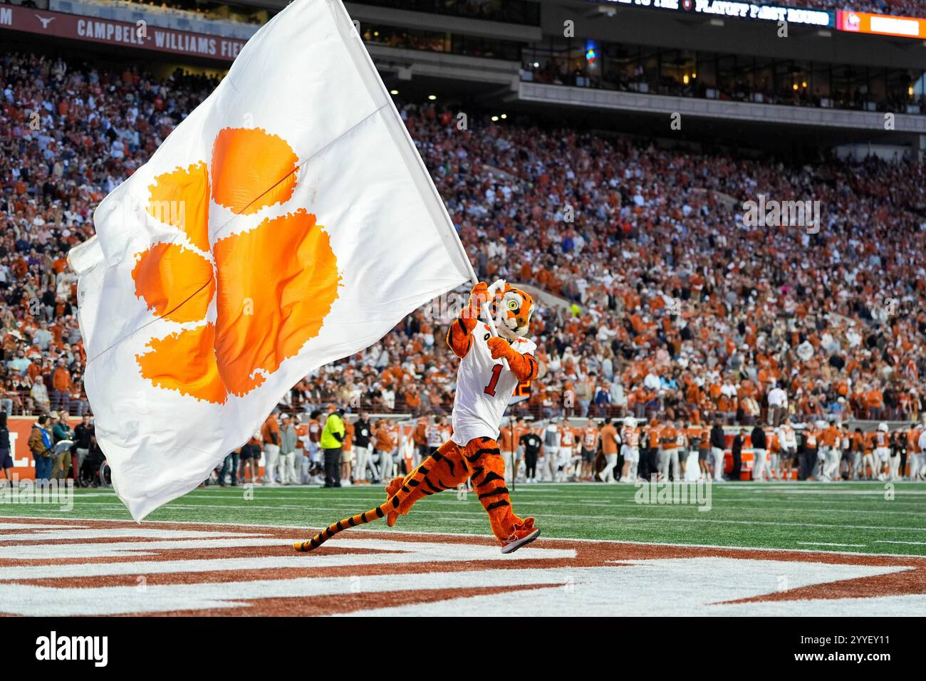 Austin, Texas. 21st Dec, 2024. The Clemson mascot runs a flag across the field after a Tigers ...