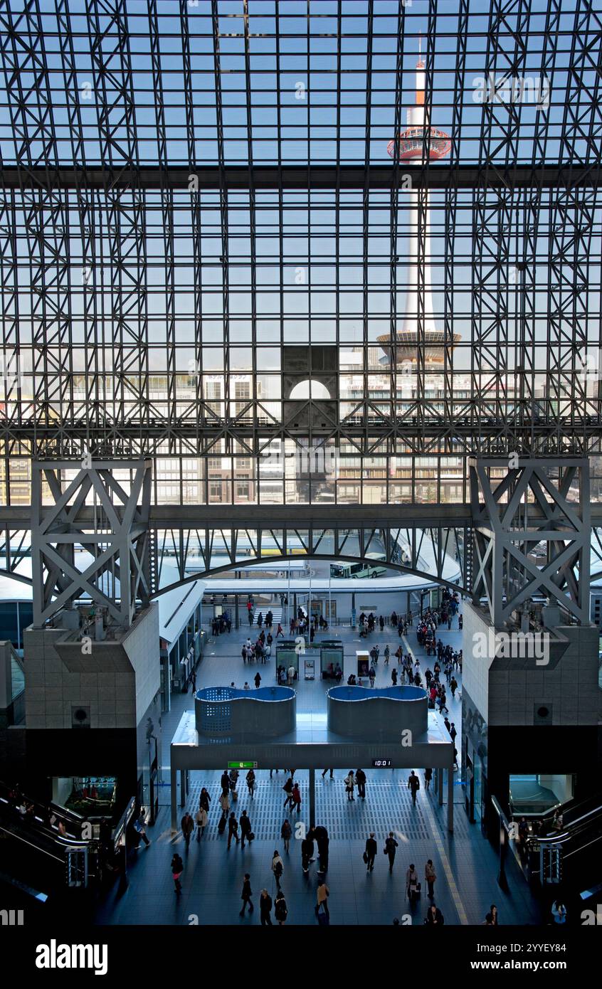 Kyoto Tower seen through the cavernous interior of the modern JR West ...