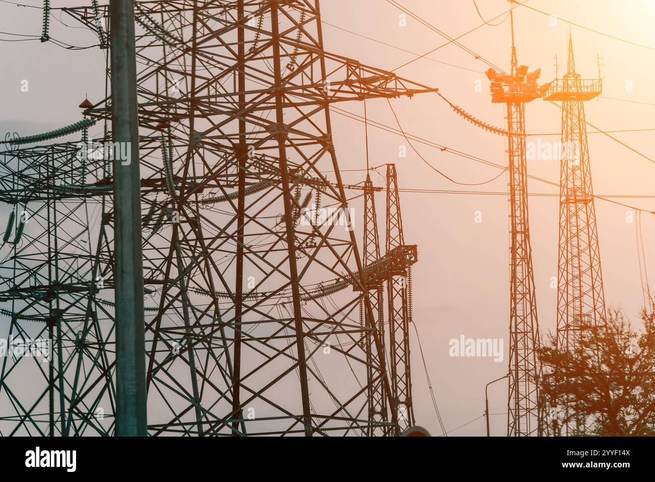 High voltage electric distribution network at sunset. Power ...