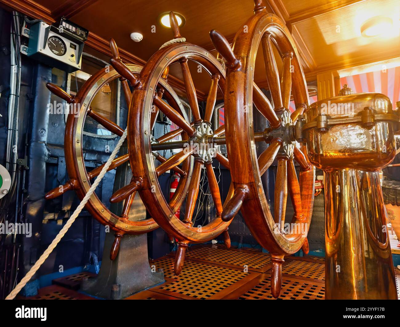 A row of wooden steering wheels located on an old vessel Stock Photo ...
