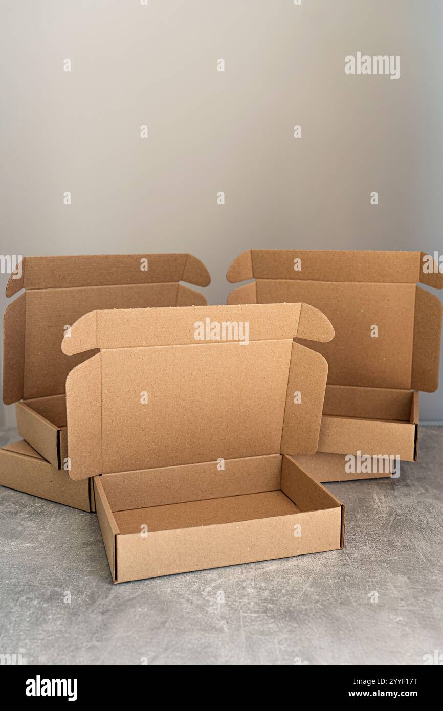 Three open kraft cardboard boxes Stock Photo - Alamy