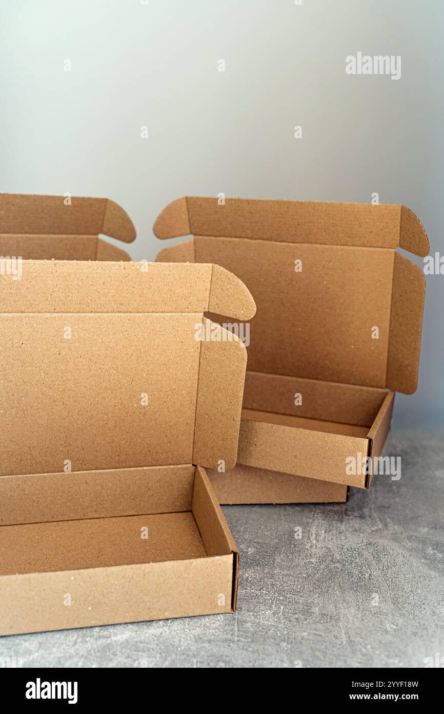 Three open kraft cardboard boxes Stock Photo - Alamy