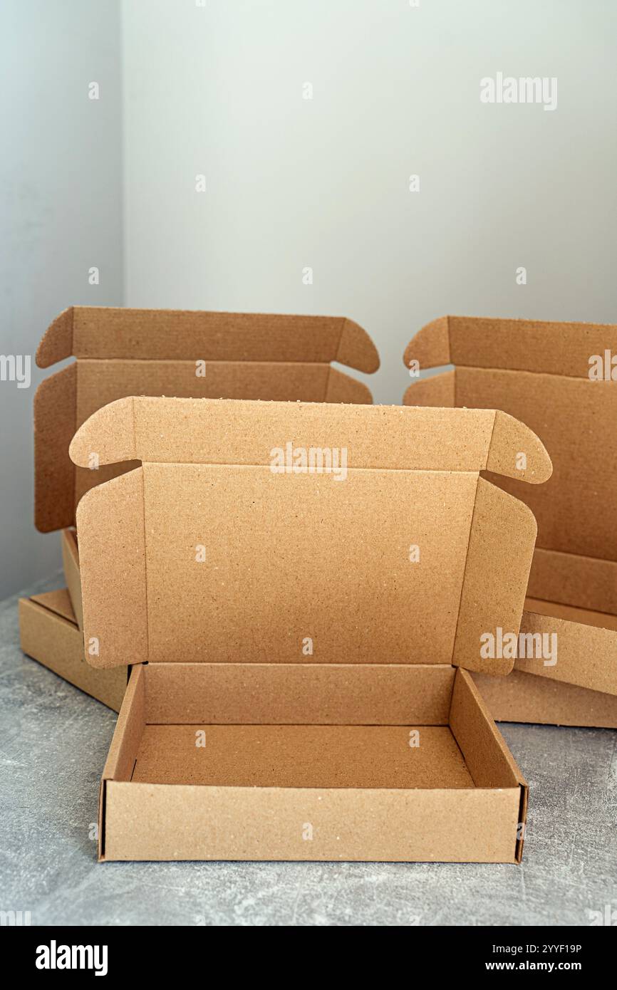Three open kraft cardboard boxes Stock Photo - Alamy