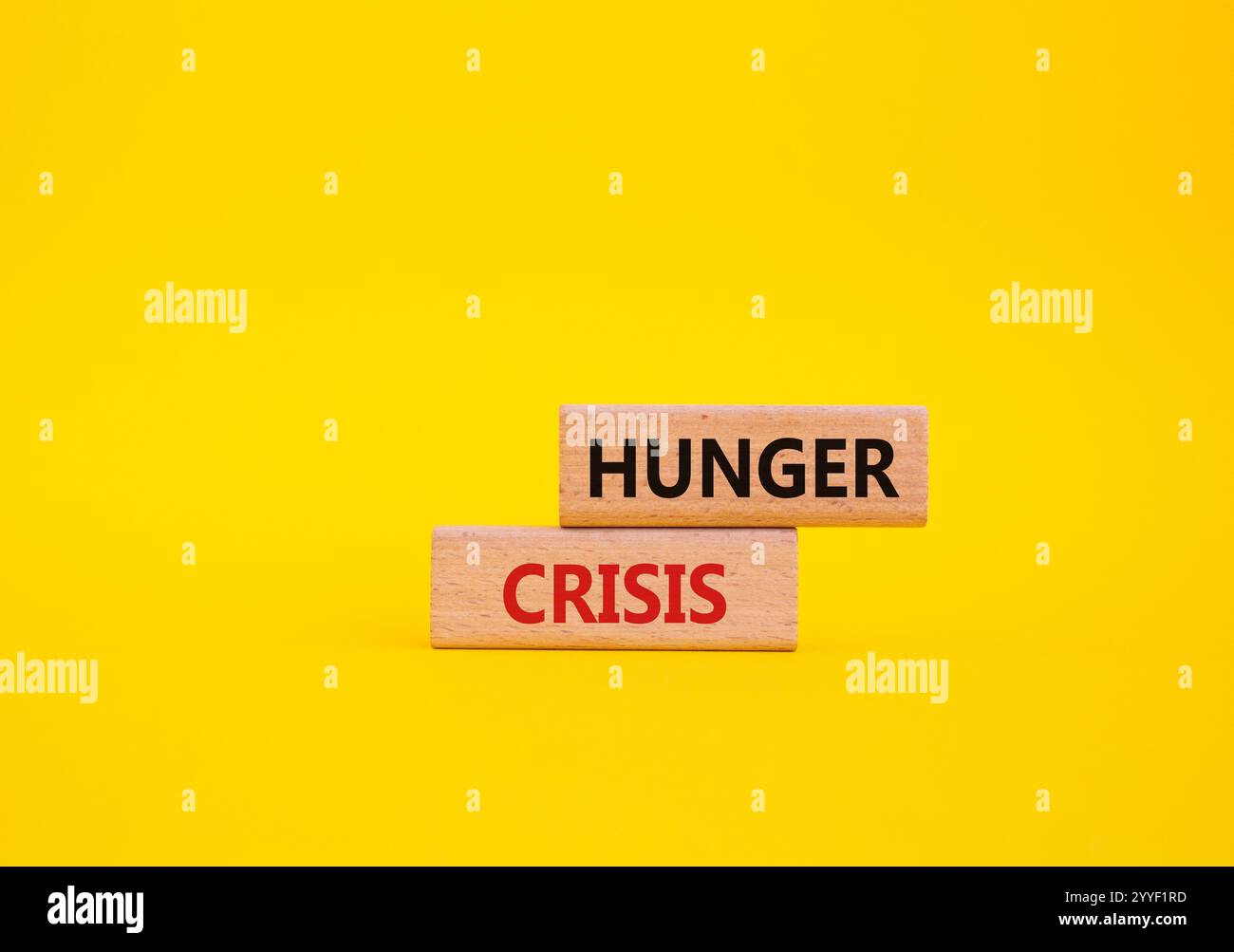 Hunger Crisis symbol. Wooden blocks with words Hunger Crisis. Beautiful ...