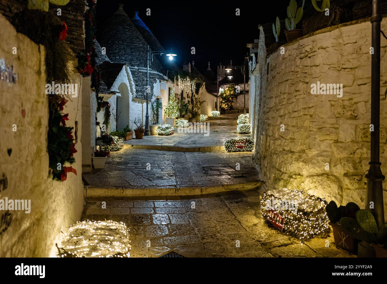 Lights and light projections illuminate the trulli of Alberobello ...