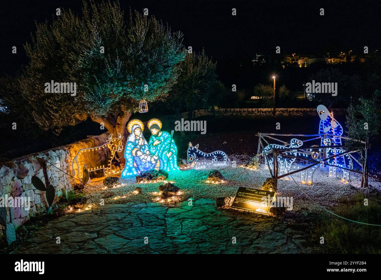 Lights and light projections illuminate the trulli of Alberobello ...