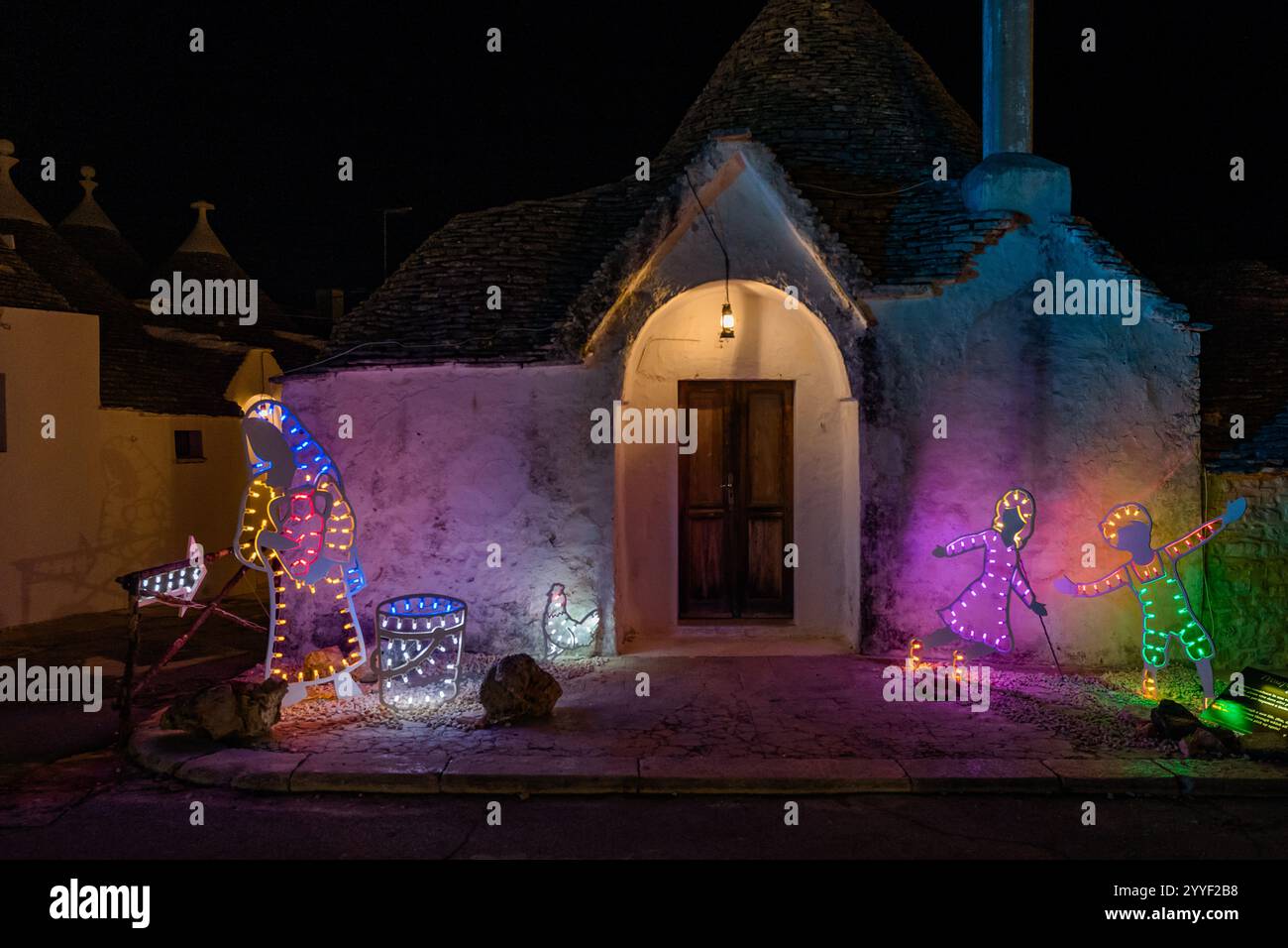 Lights and light projections illuminate the trulli of Alberobello ...