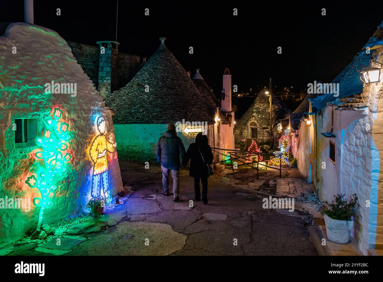 Lights and light projections illuminate the trulli of Alberobello ...
