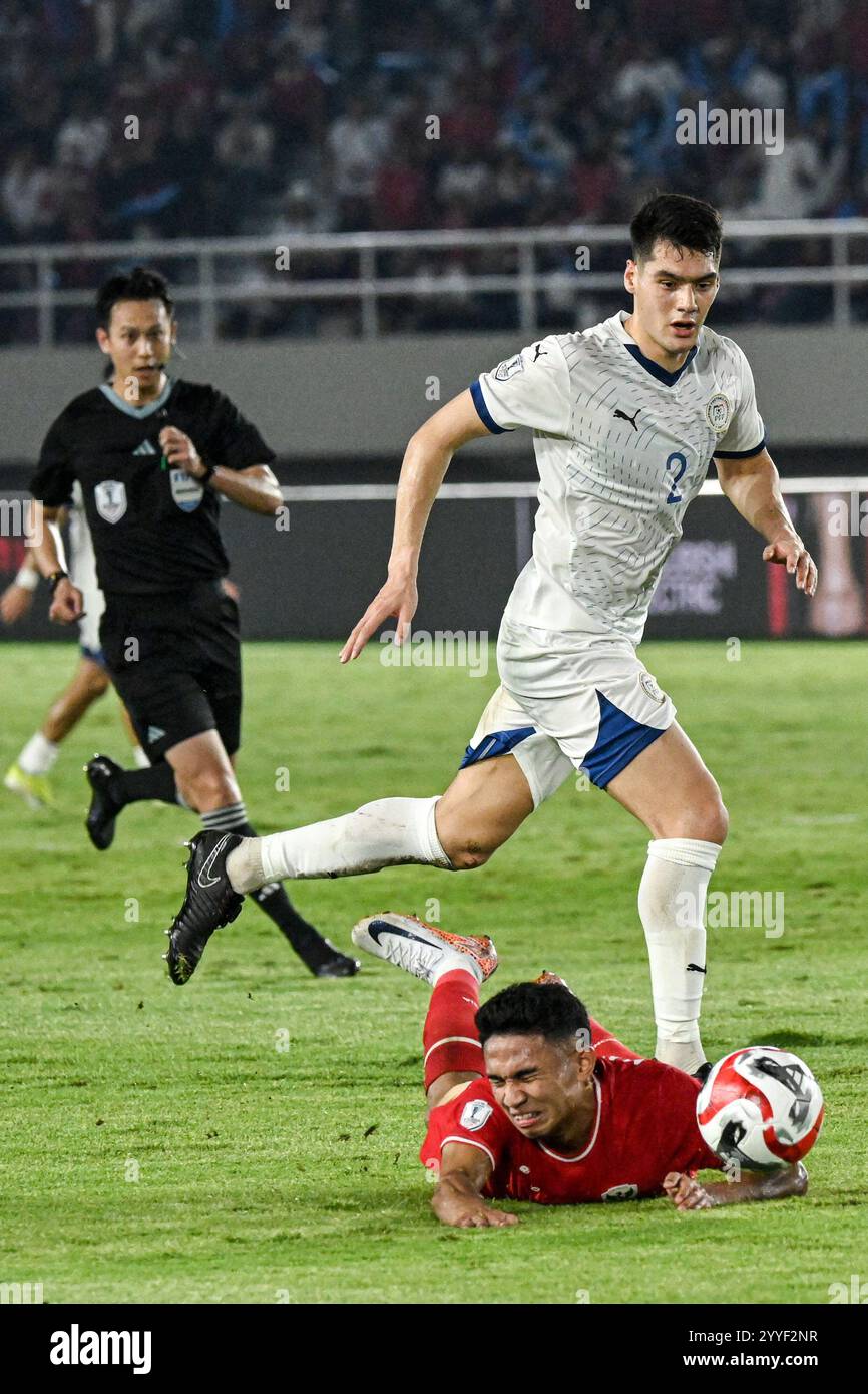 Surakarta, Indonesia. 21st Dec, 2024. Marselino Ferdinan (Bottom) of ...