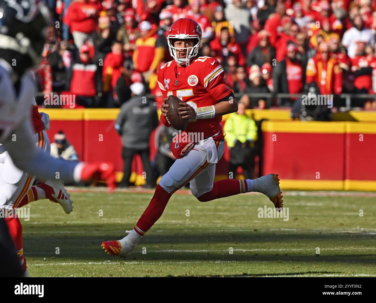 Kansas City Chiefs quarterback Patrick Mahomes (15) rolls out with the ...