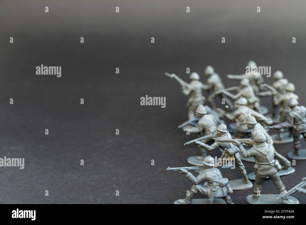 Miniature toy soldiers in posing for attack in the battlefield Stock ...