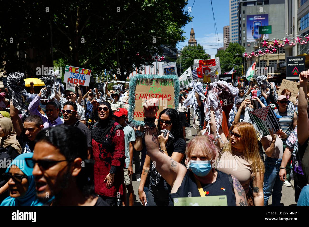 Melbourne, Australia. 22nd Dec, 2024. Protesters chant slogans during ...