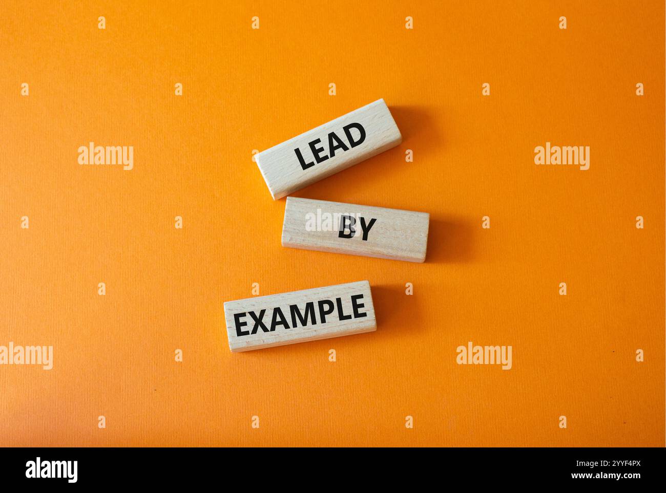 Lead by Example symbol. Concept word Lead by Example on wooden cubes ...