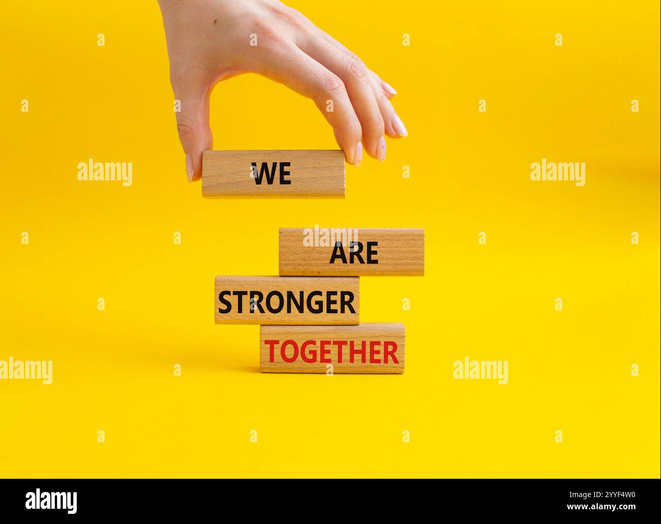 We are stronger together symbol. Wooden blocks with words We are ...