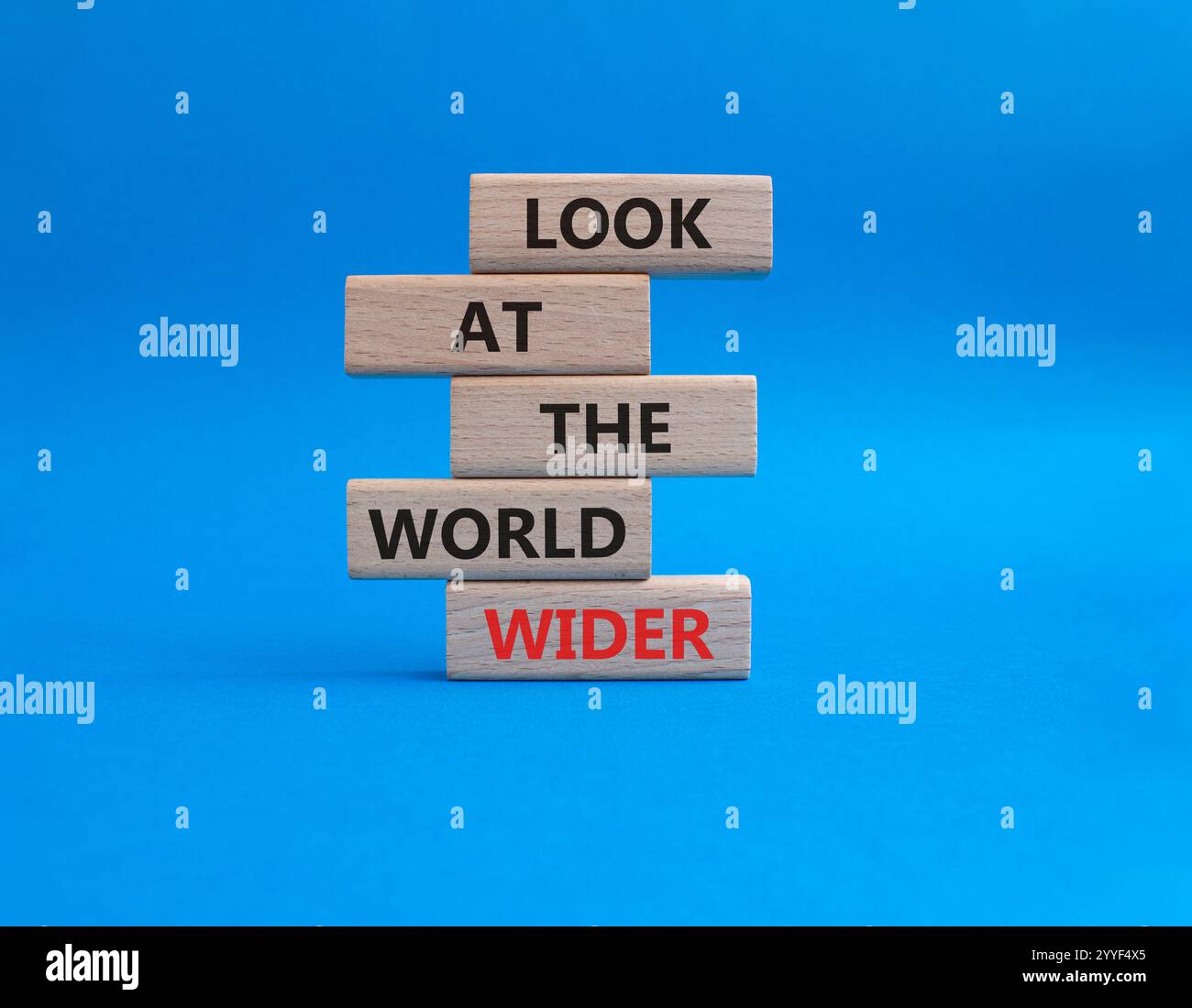Look at the world wider symbol. Wooden blocks with words Look at the ...