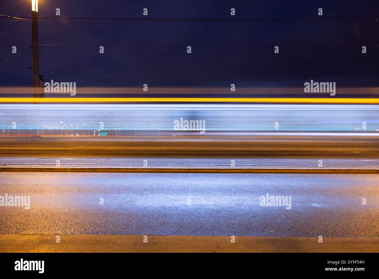 Bonn, Germany. 22nd Dec, 2024. The passing lights of a streetcar can be ...