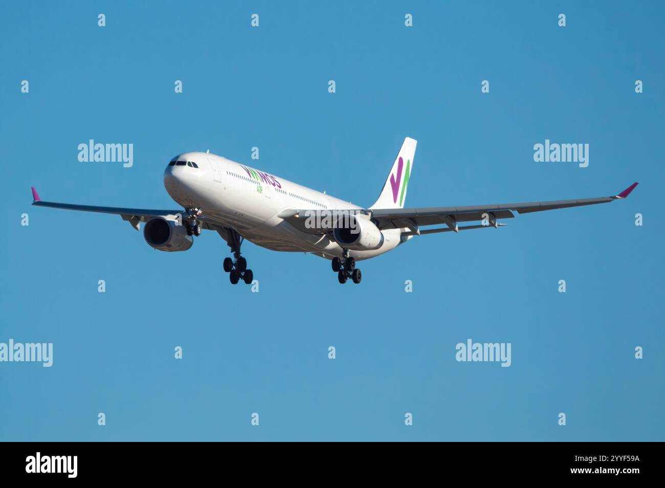 Long-haul twin-aisle airliner Airbus A330 of the Wamos Air airline landing at Madrid Bajaras ...