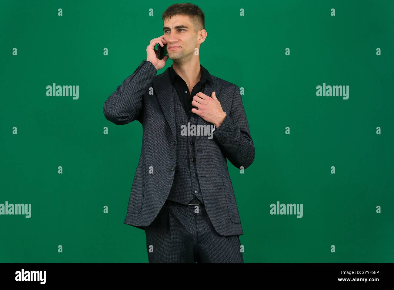 An Indian man looks tense and frustrated while talking on his mobile ...