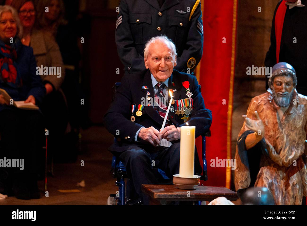D-Day veteran Bernard Morgan lights a candle during the Together At ...