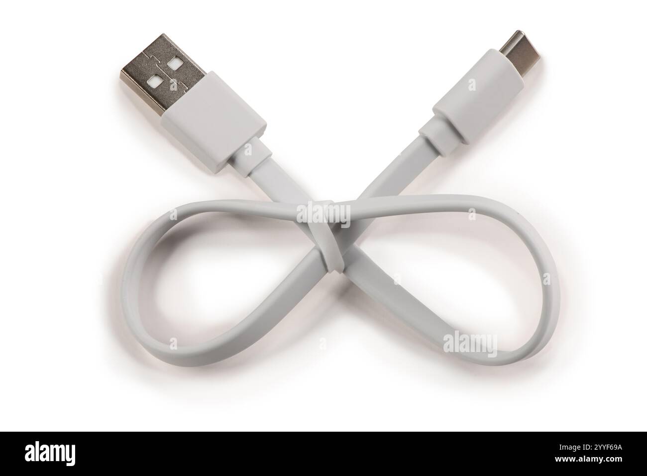 White USB cable in bow shape on white background. High resolution photo ...