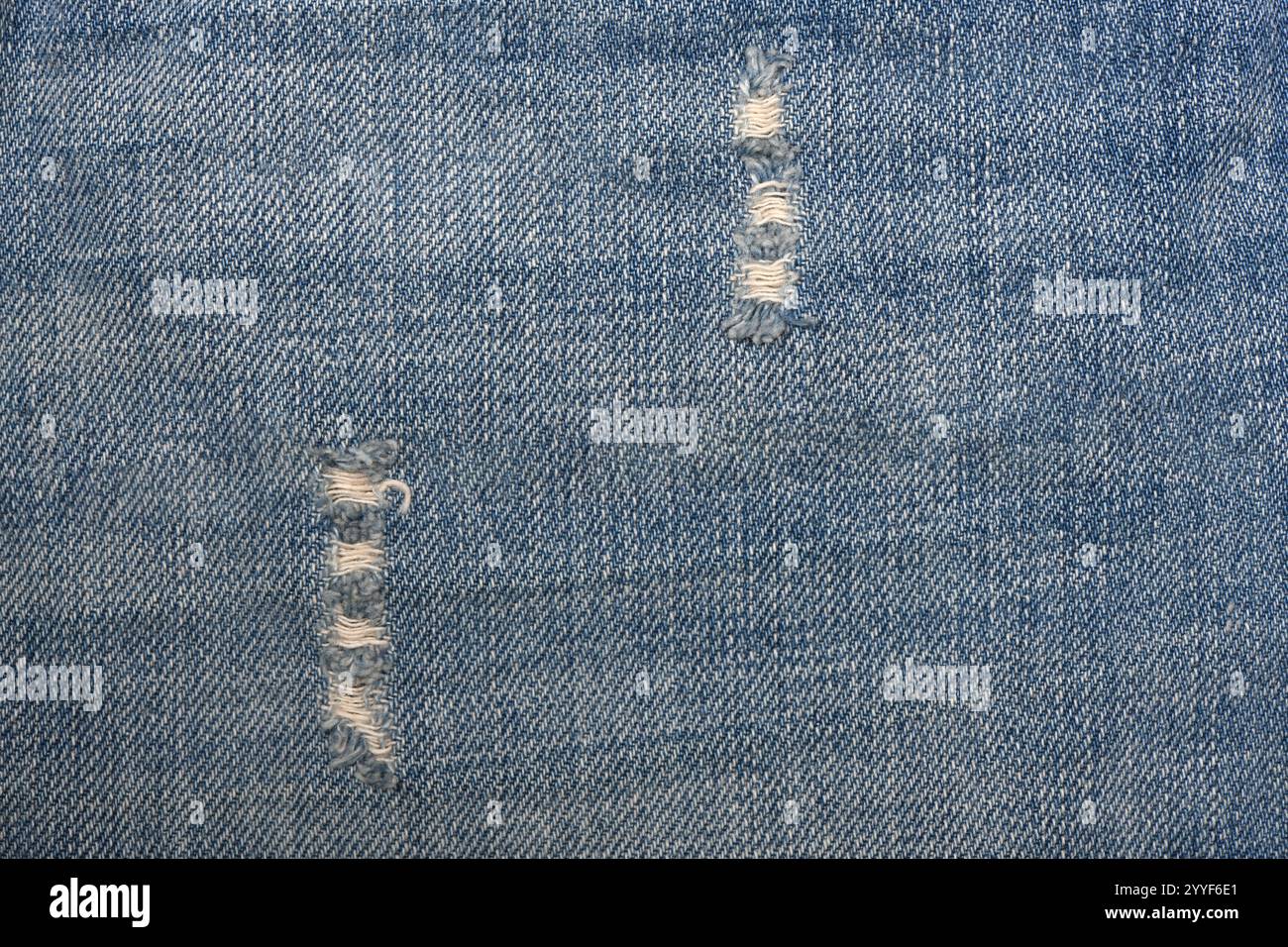 Ripped blue hipster jeans material. Destroyed denim Cloth texture ...