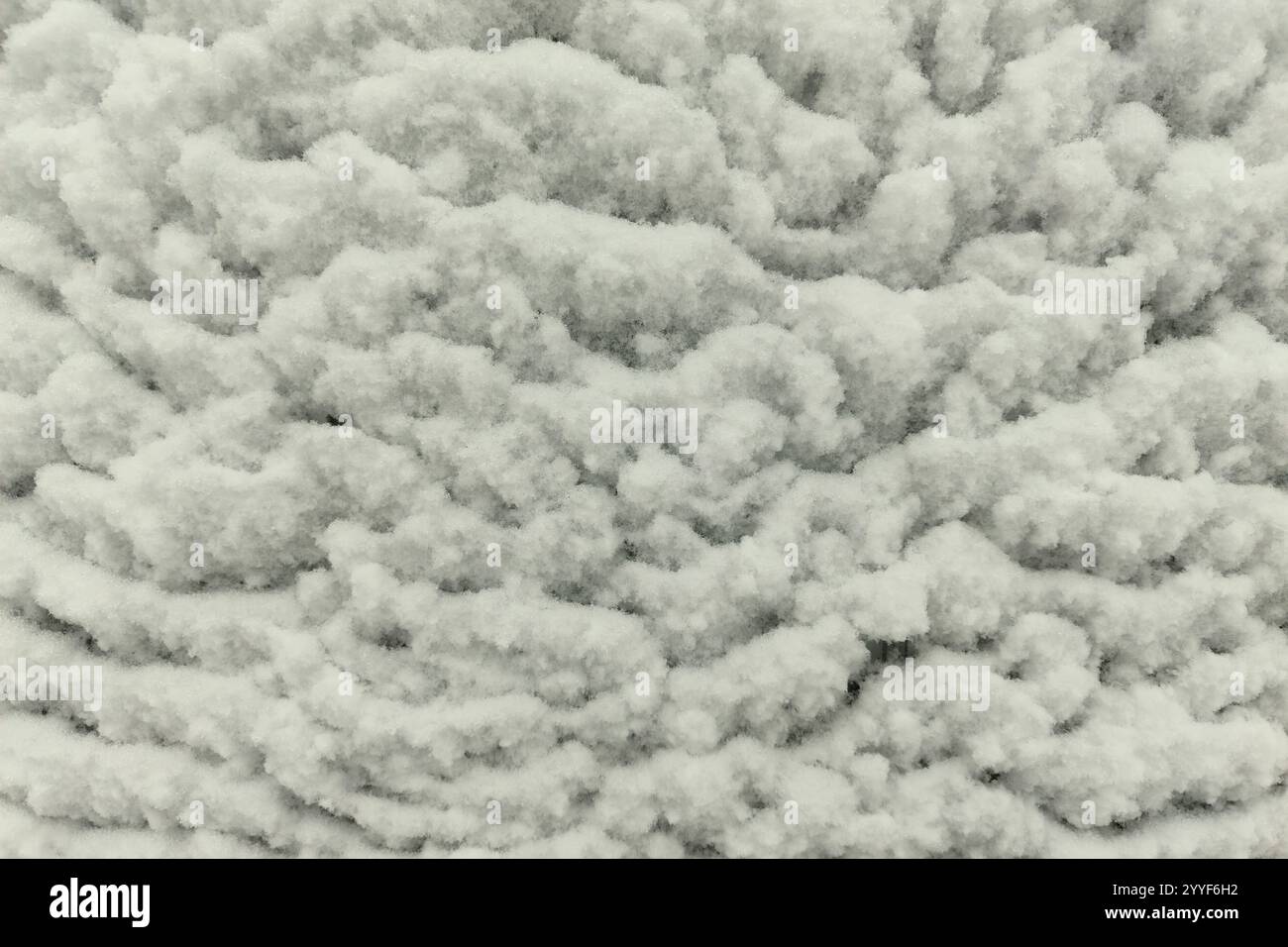 Snow flakes stuck in the form of waves on a white metal sheet. Close-up. Texture for Background ...