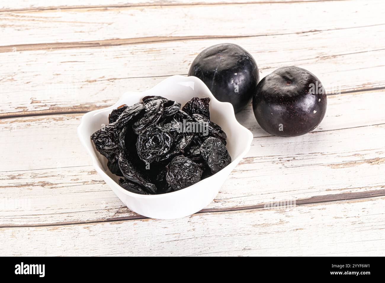 Dry sweet prunes in thw bowl Stock Photo - Alamy