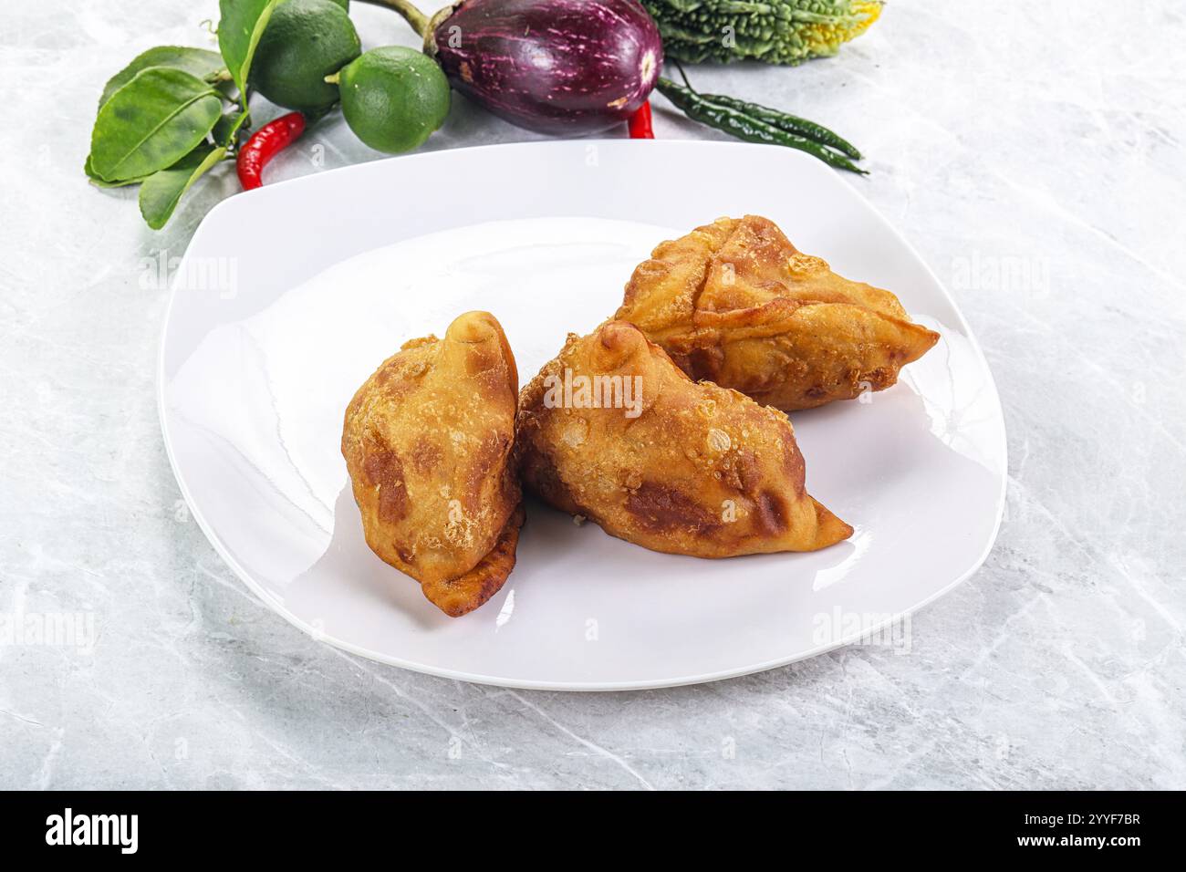 Indian cuisine - fries crispy stuffed samosa Stock Photo - Alamy