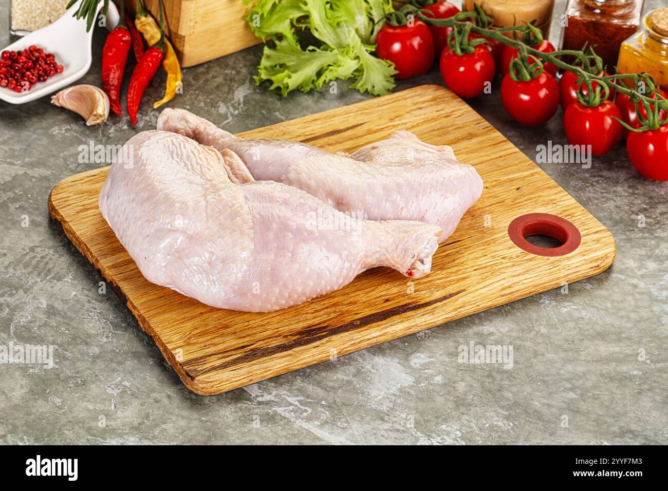Raw chicken leg foe cooking over board Stock Photo - Alamy