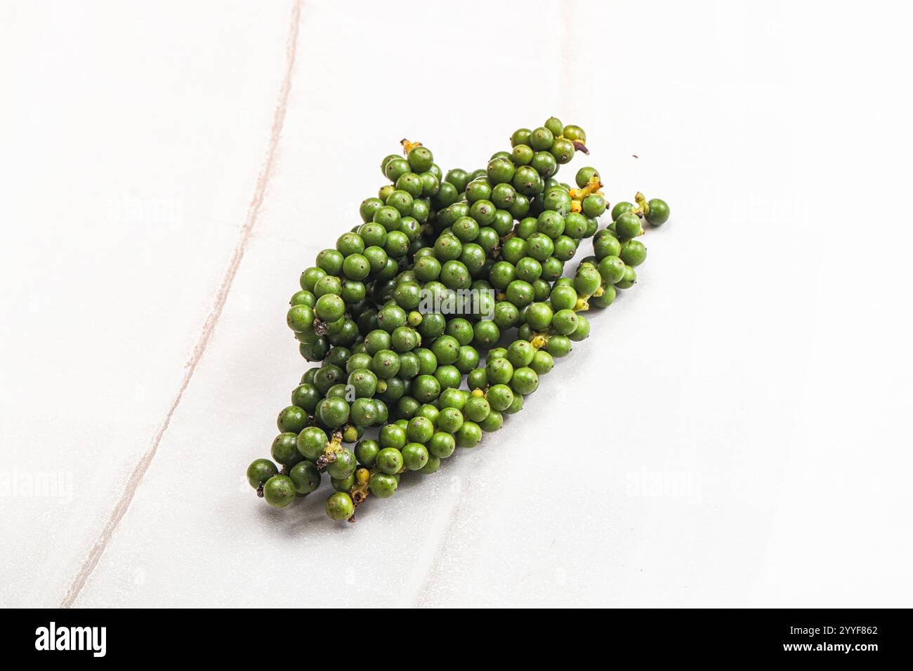 Green pepper corn on the branch heap Stock Photo - Alamy