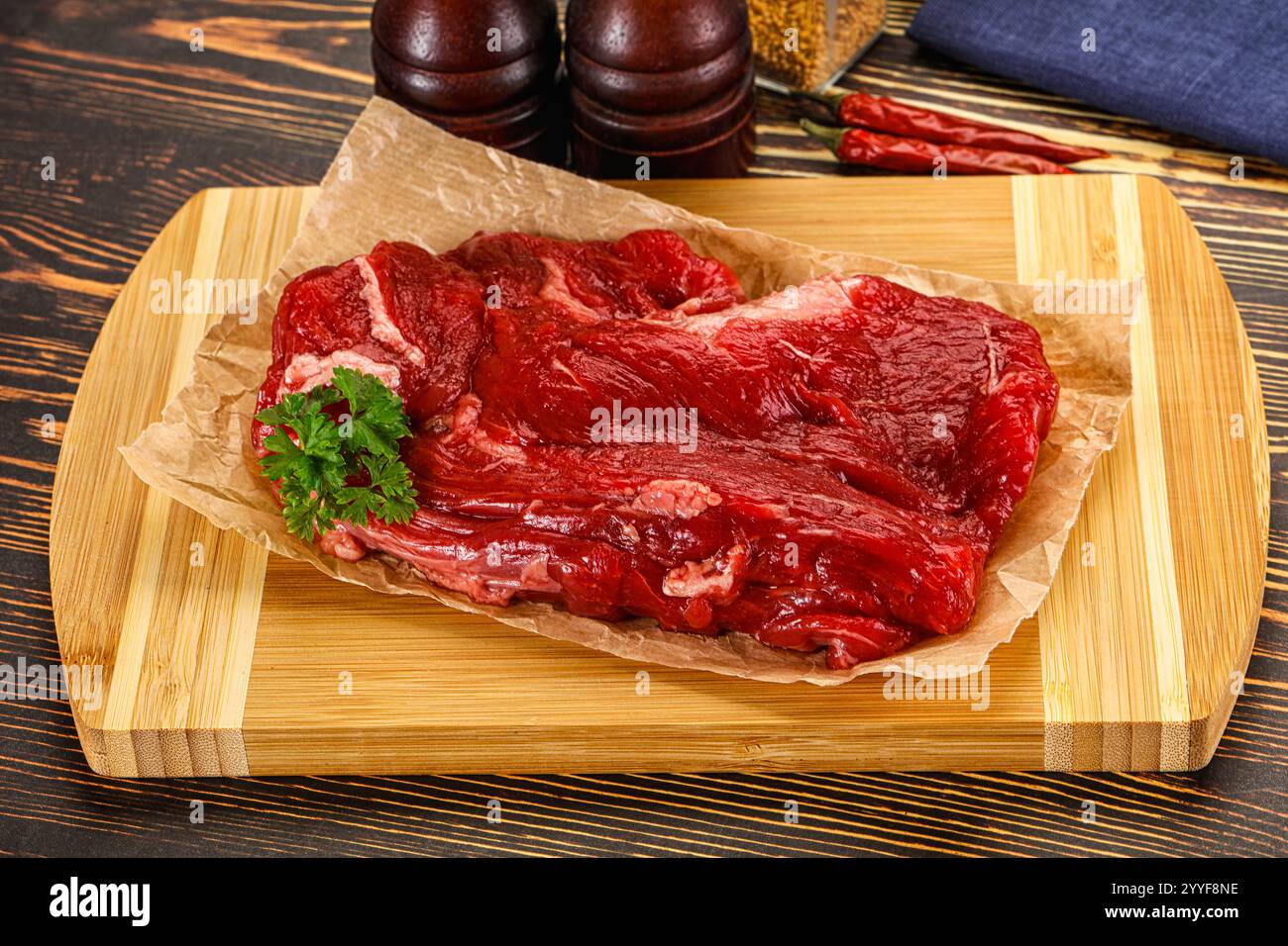 Raw beef meat piece over board for cooking Stock Photo - Alamy